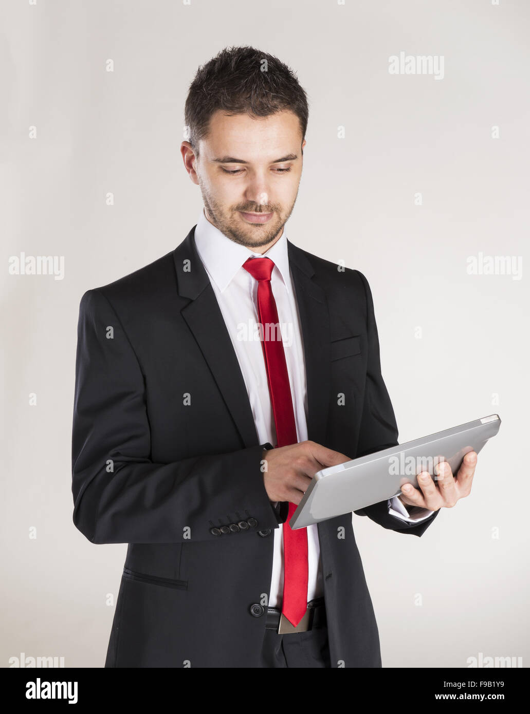 Successful business man is standing on isolated white background Stock ...