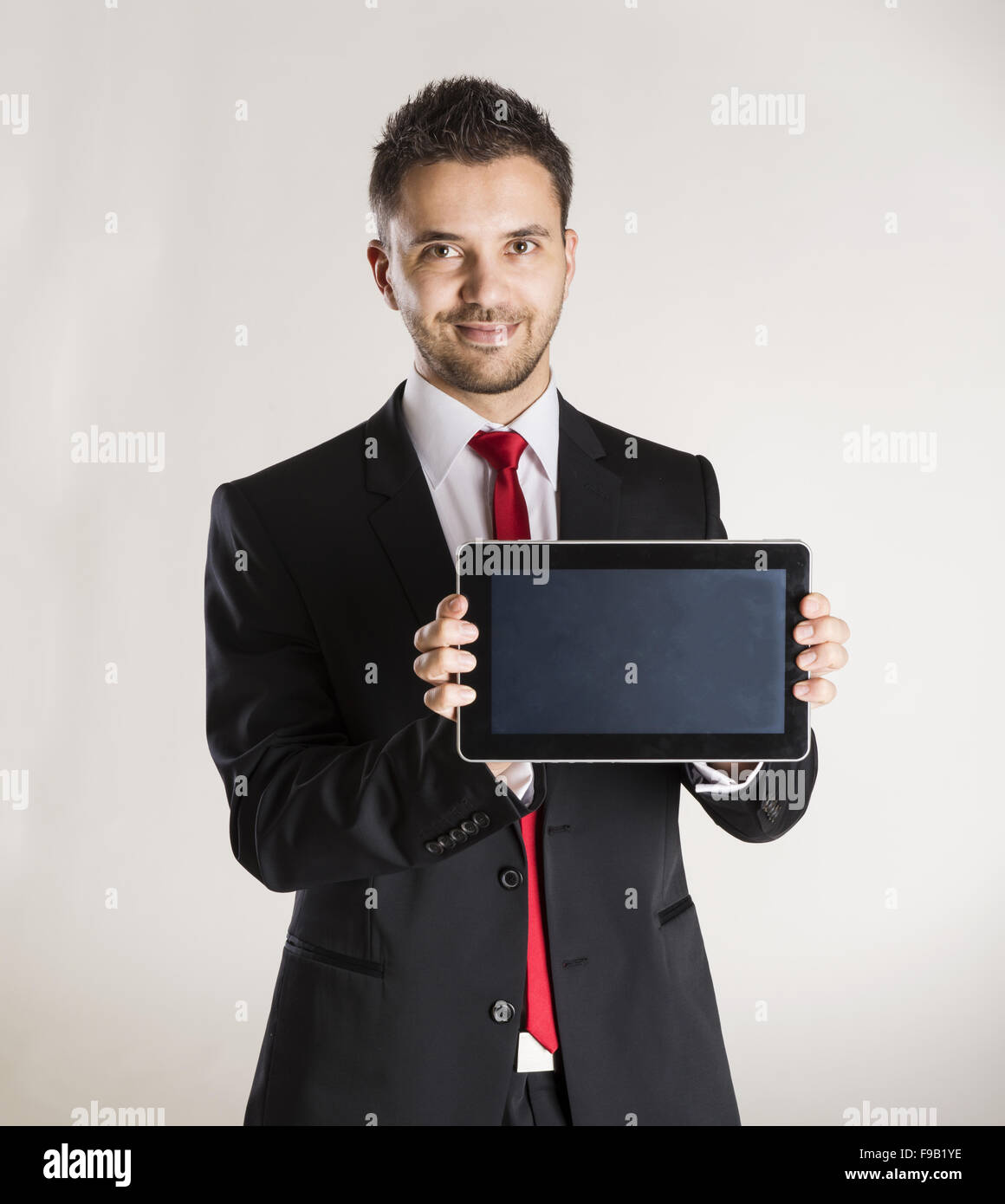 Successful business man is standing on isolated white background Stock ...