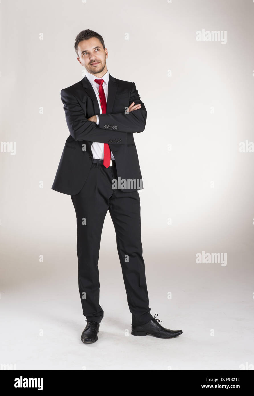 Successful business man is standing on isolated white background Stock ...