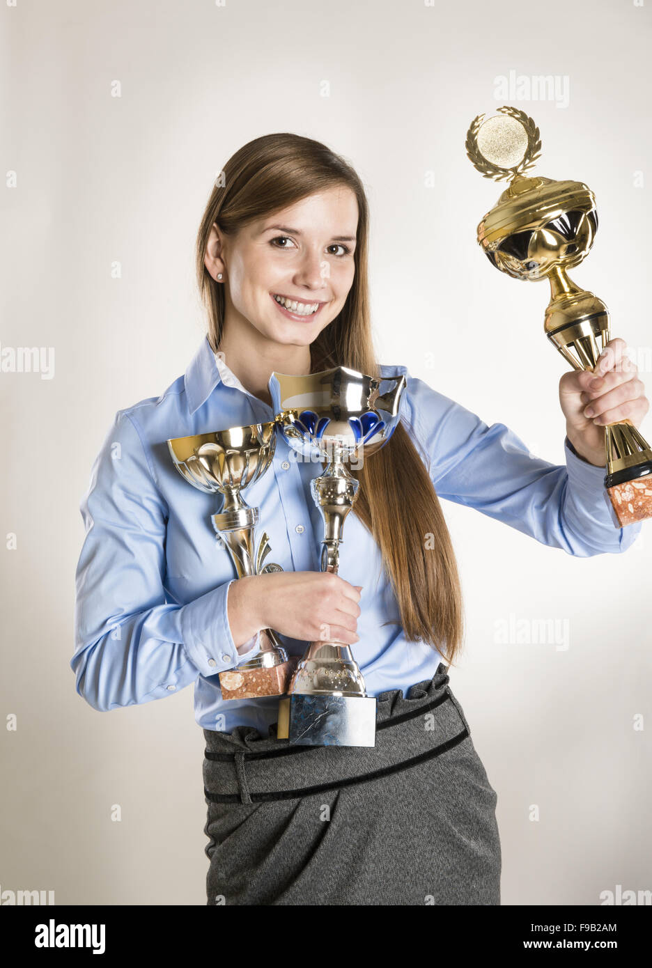 Portrait of successful business woman with trophy Stock Photo - Alamy