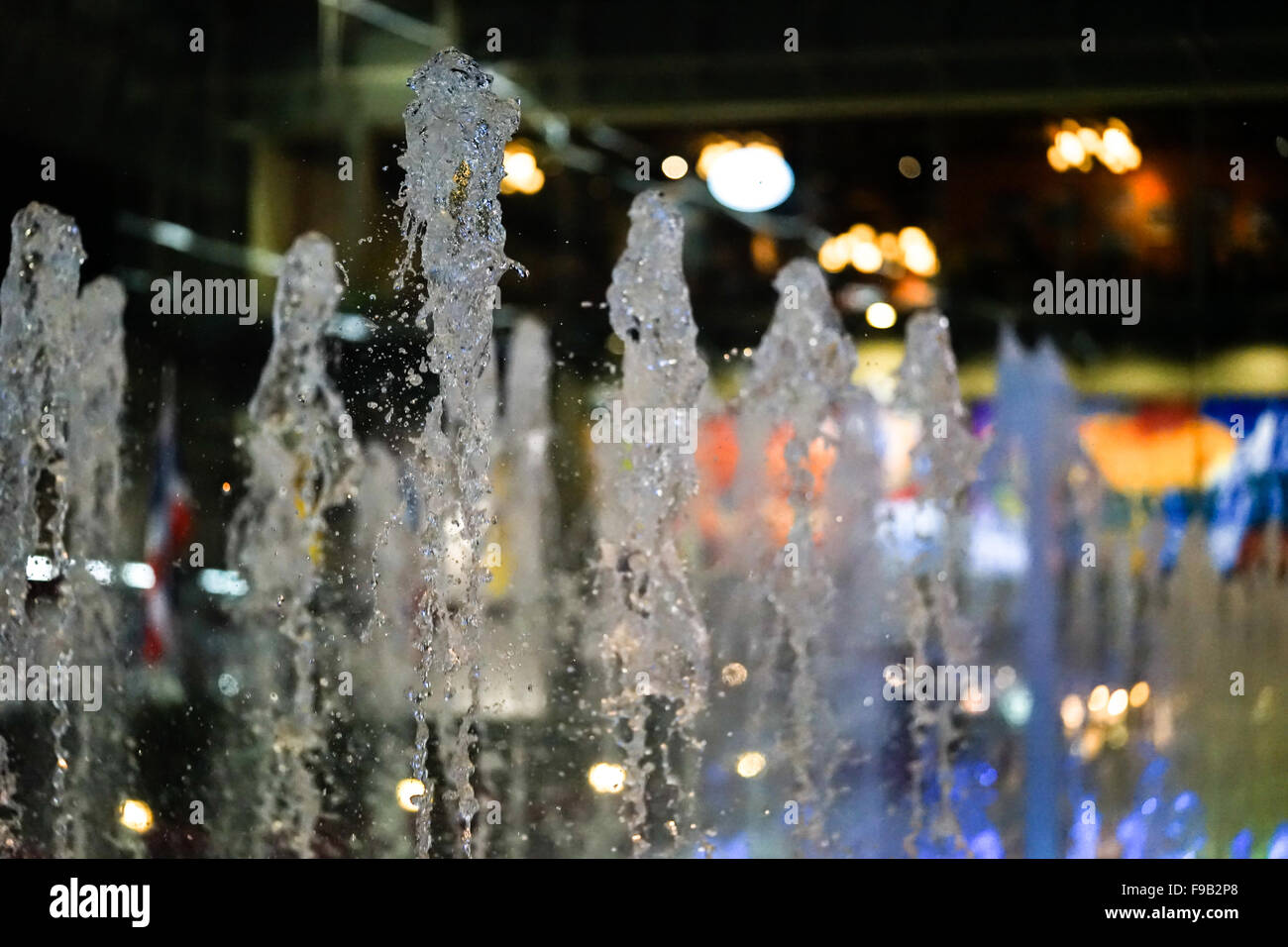 Fountains splash at night in Bangkok Stock Photo - Alamy