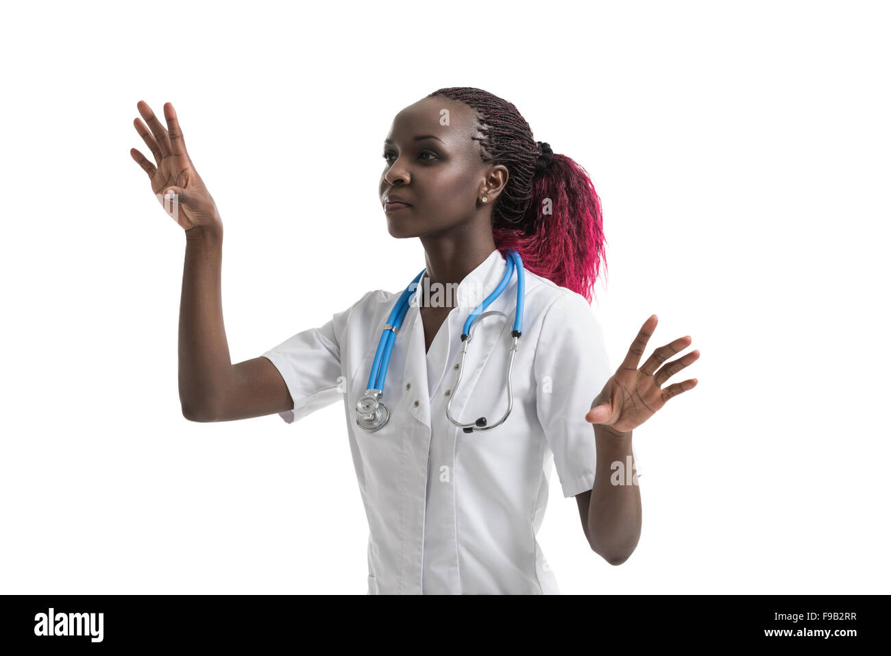 Female african doctor with stethoscope working with virtual screen ...