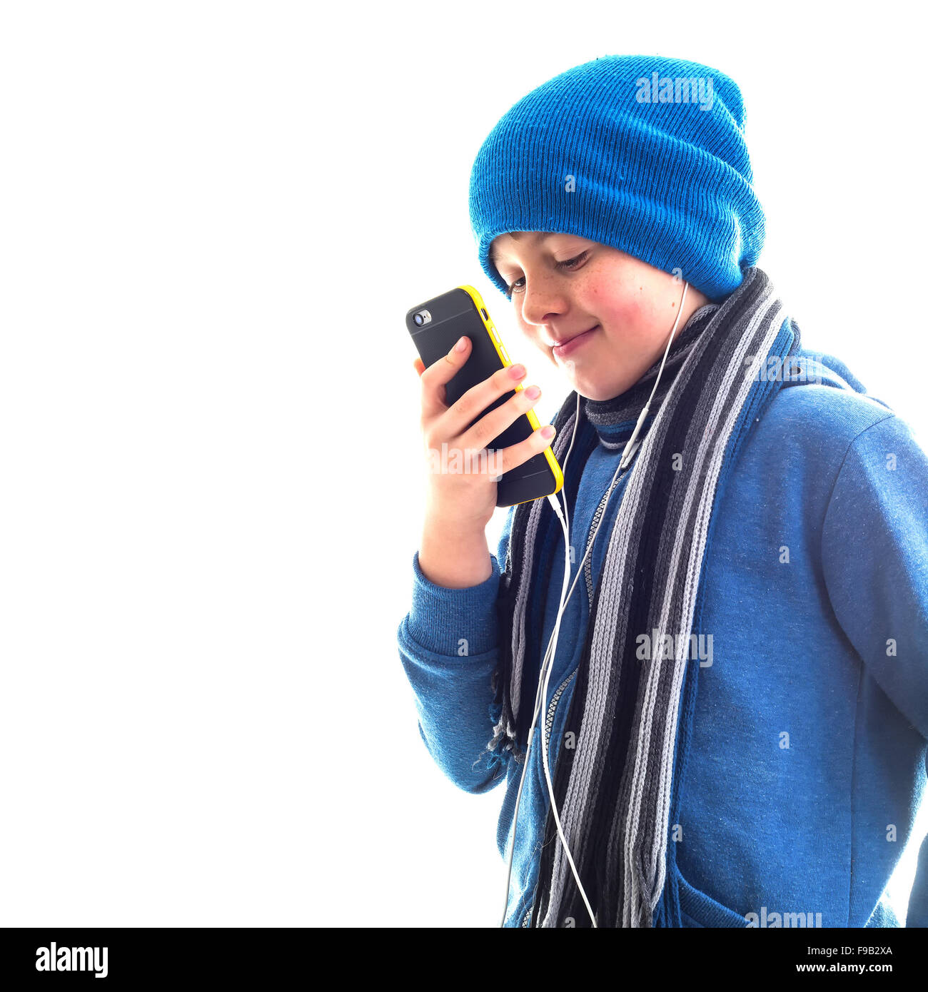 Young Boy with Mobile Phone Against White Background Stock Photo - Alamy
