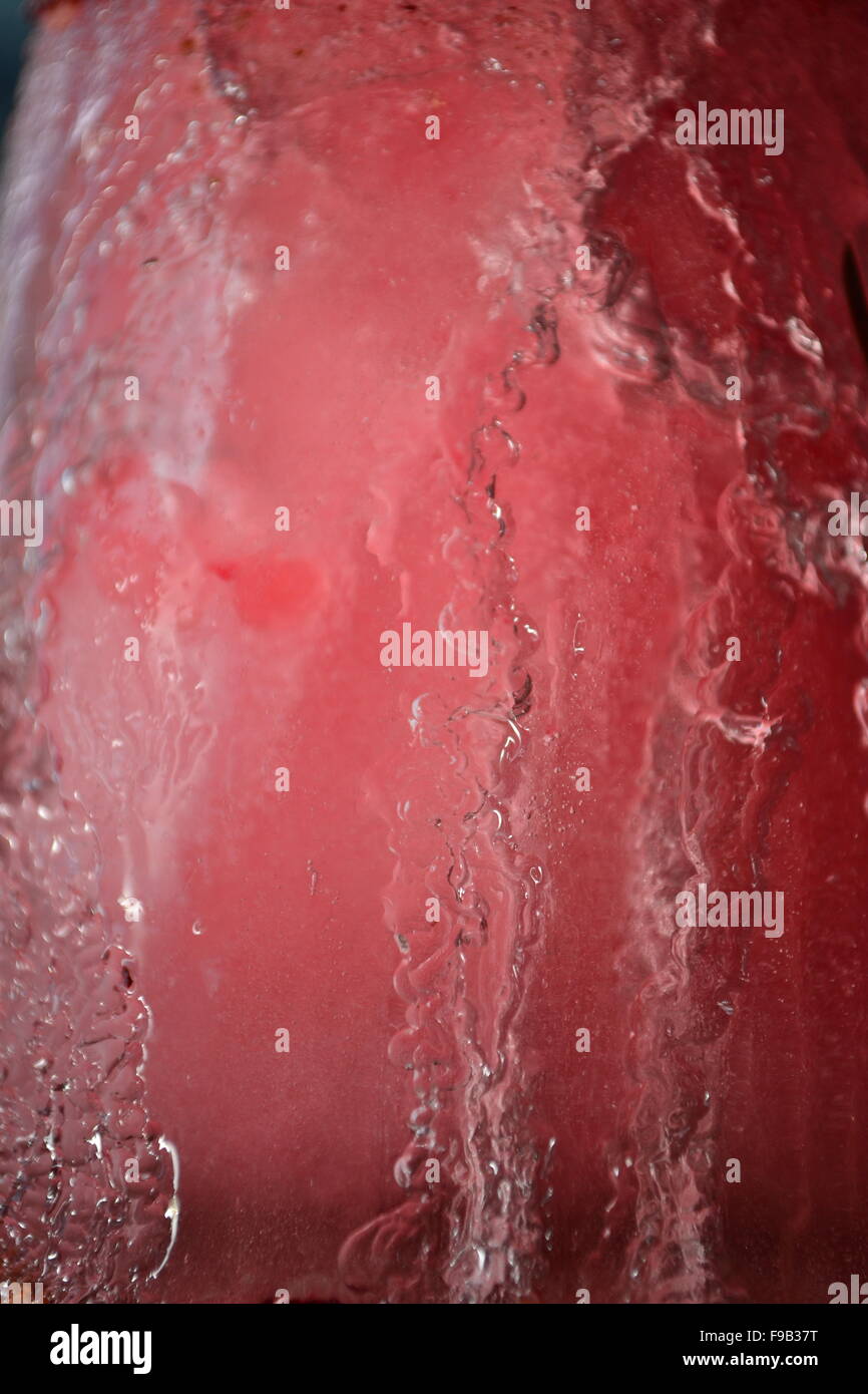 Red pink frozen water ice icy structure abstract Stock Photo - Alamy