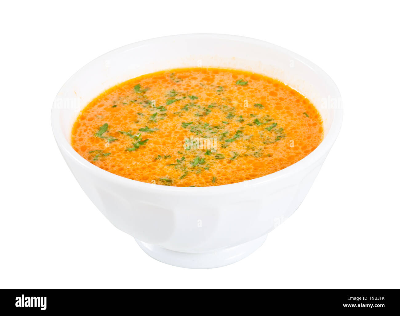 a plate of soup on a white background Stock Photo - Alamy