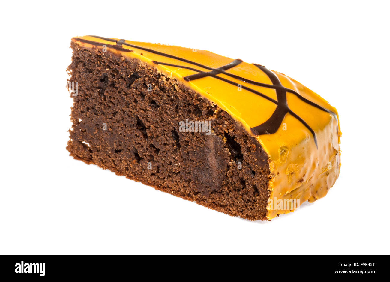 Piece of chocolate cake with icing on white isolated background Stock ...