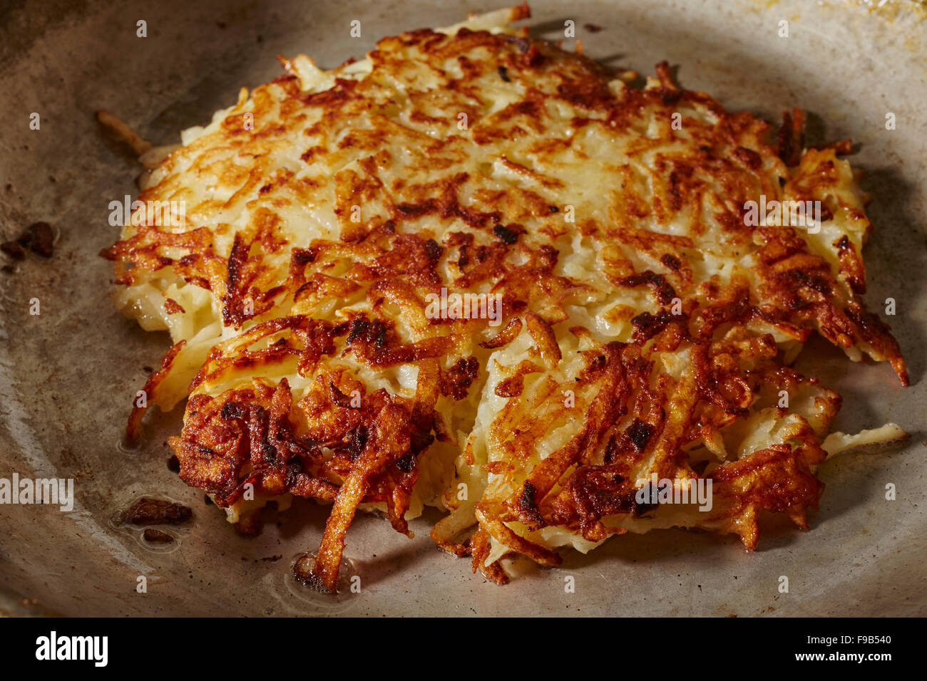 A latke frying - Eastern European Jewish style potato pancakes served ...