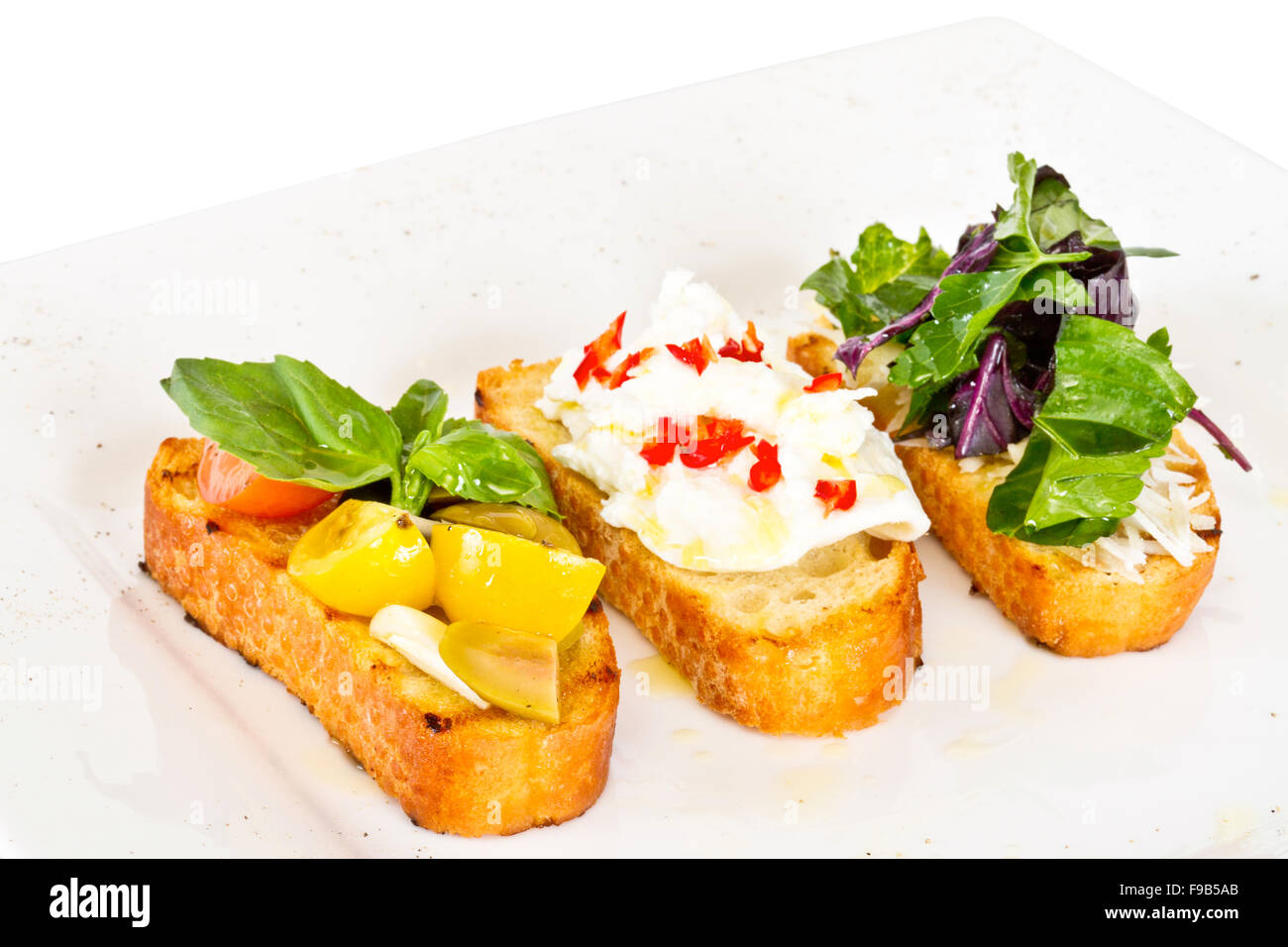 different colored Canapes on a white background Stock Photo - Alamy