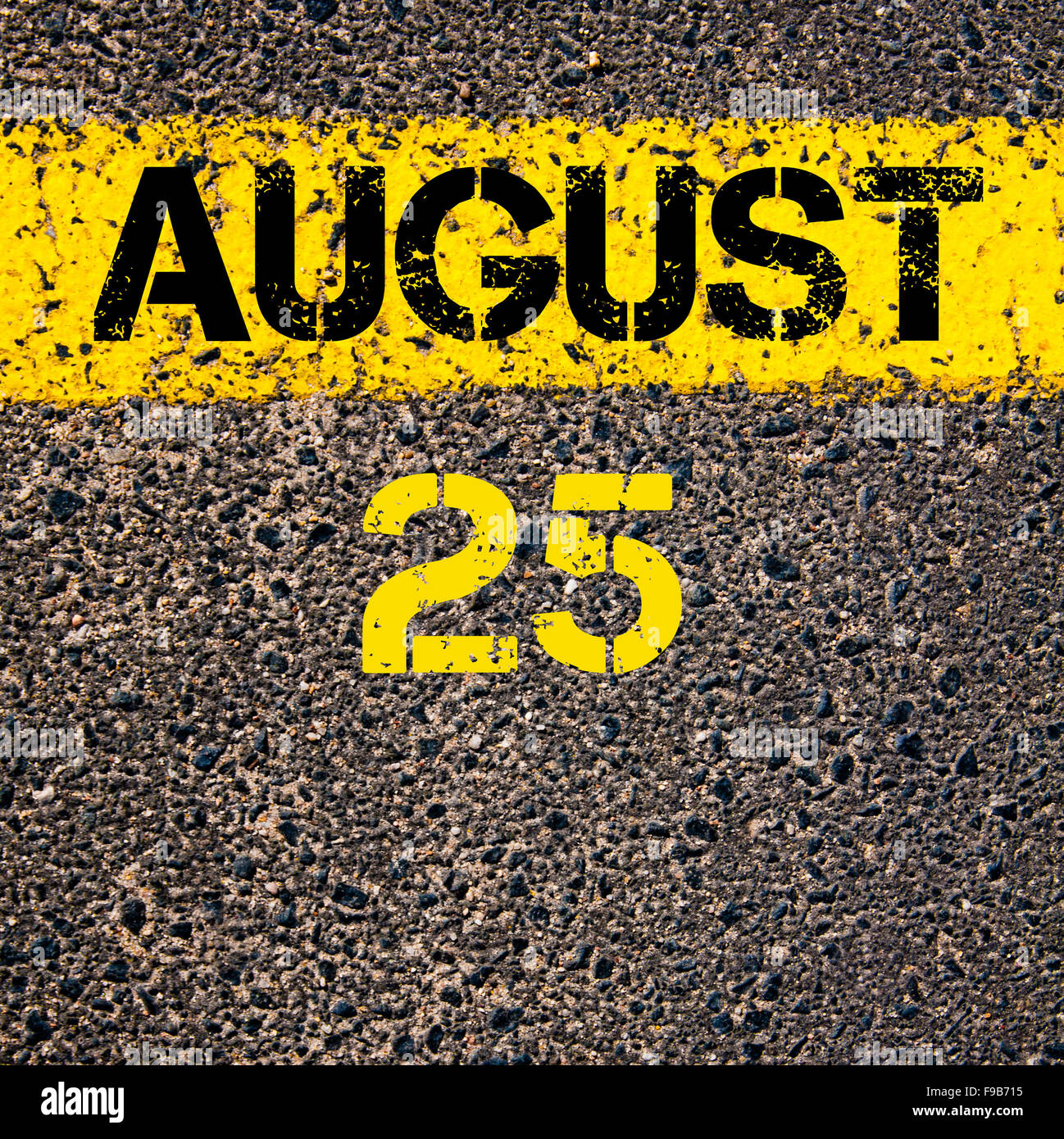 25 August calendar day written over road marking yellow paint line ...