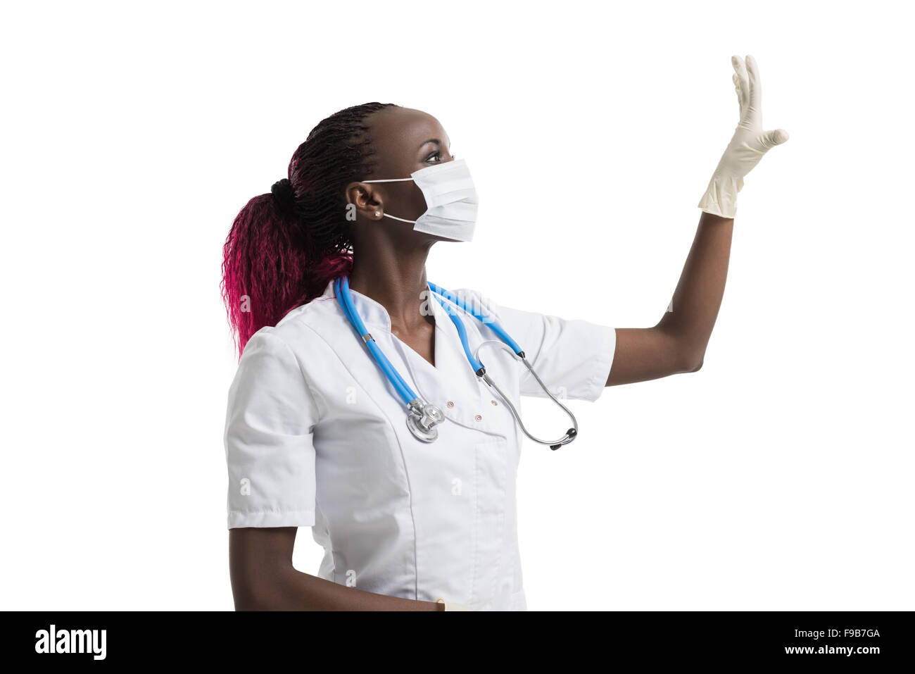 Female african doctor with stethoscope working with virtual screen ...