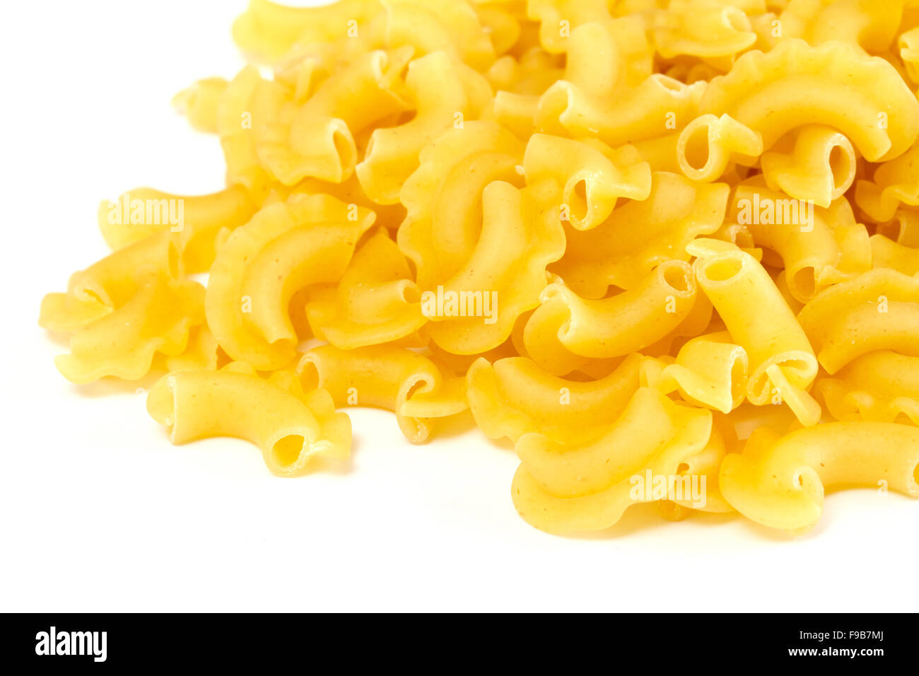 dried italian pasta (macaroni) isolated on white background Stock Photo ...