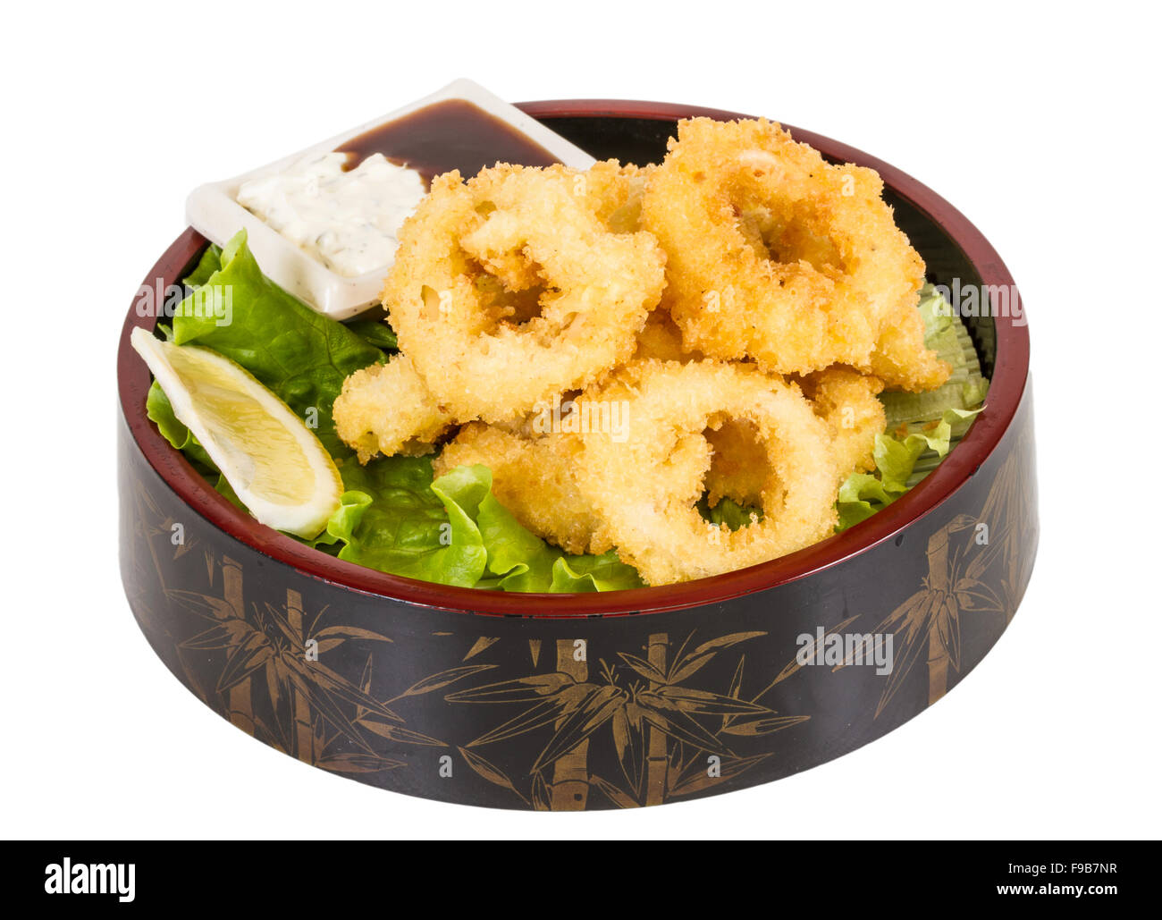 Deep batter fried squid rings calamari with green salad Stock Photo - Alamy
