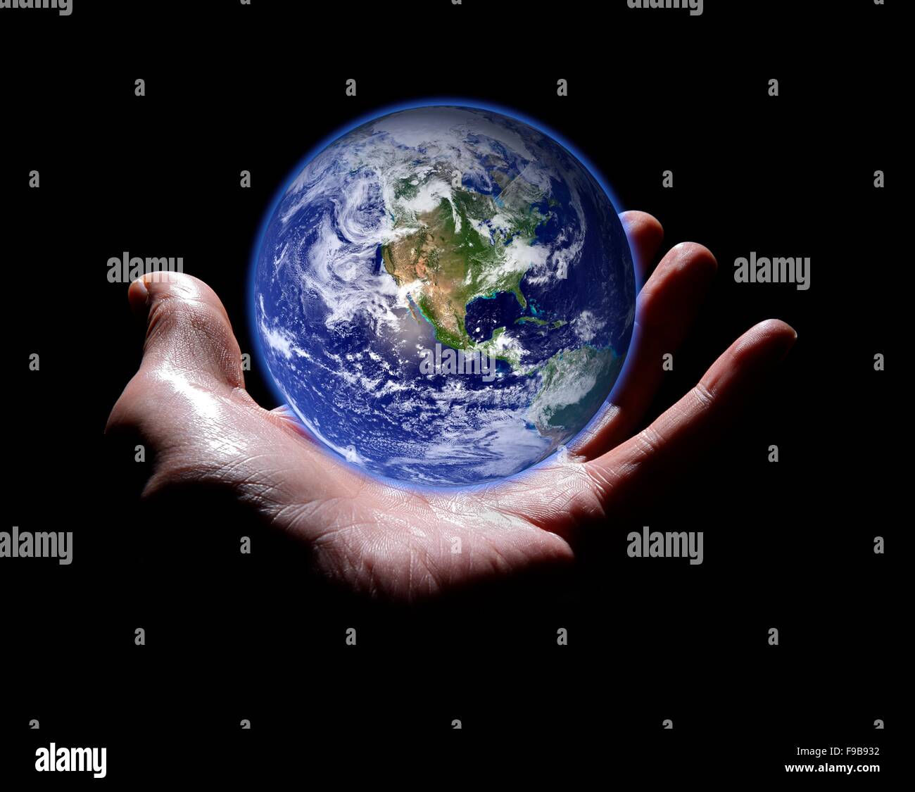 Hand holding the earth, computer artwork Stock Photo - Alamy