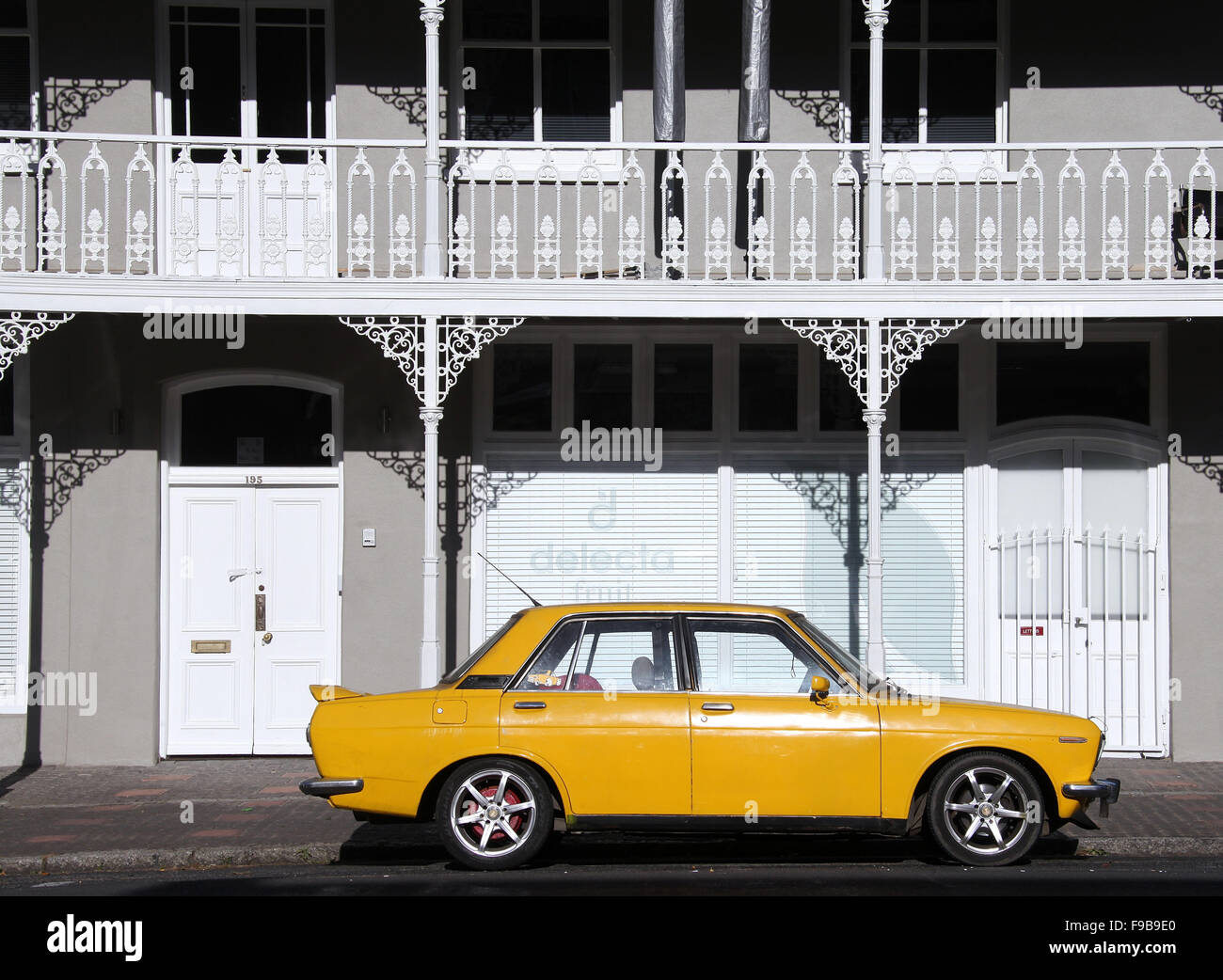 Yellow car and colonial architecture in the Western Cape town of Paarl ...