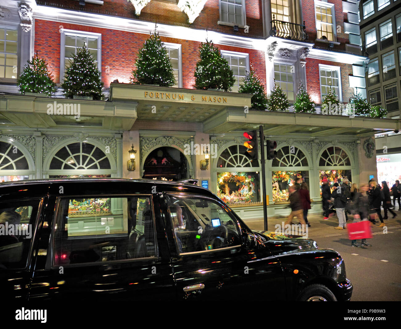 Fortnum & Mason store entrance at night with festive lit Christmas ...