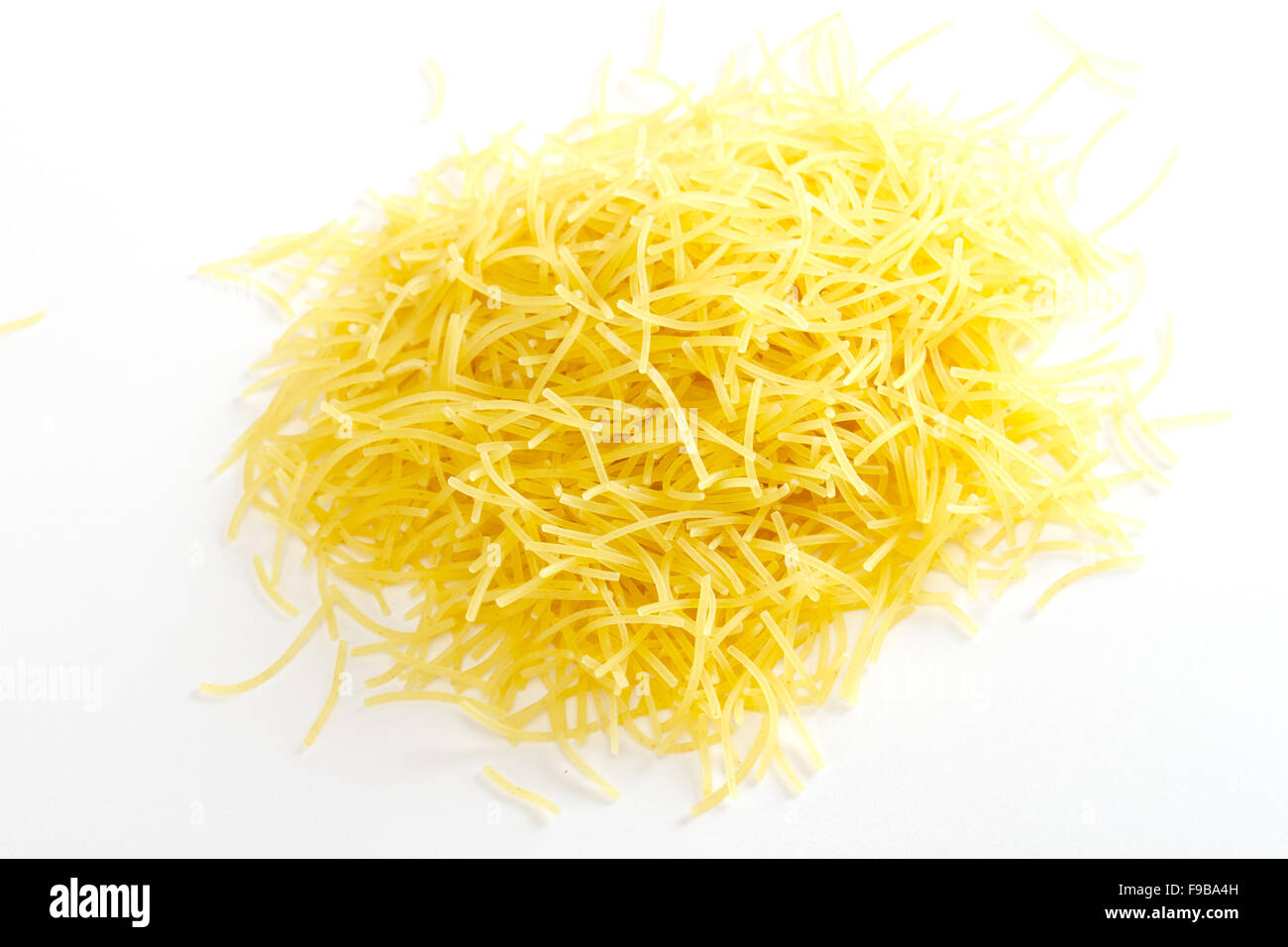 dried italian pasta (macaroni) isolated on white background Stock Photo ...