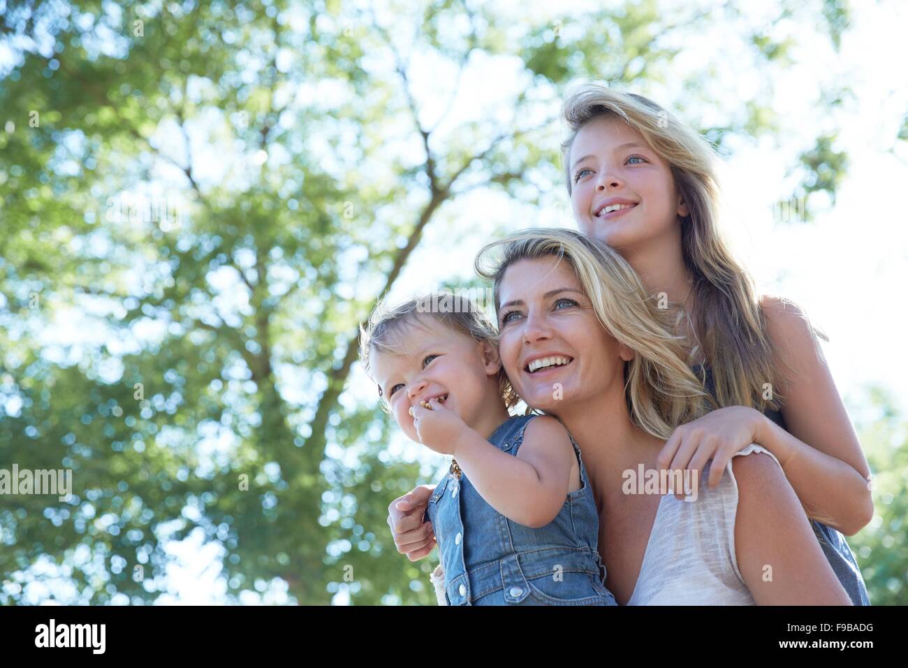 MODEL RELEASED. Mother with her two daughters Stock Photo - Alamy