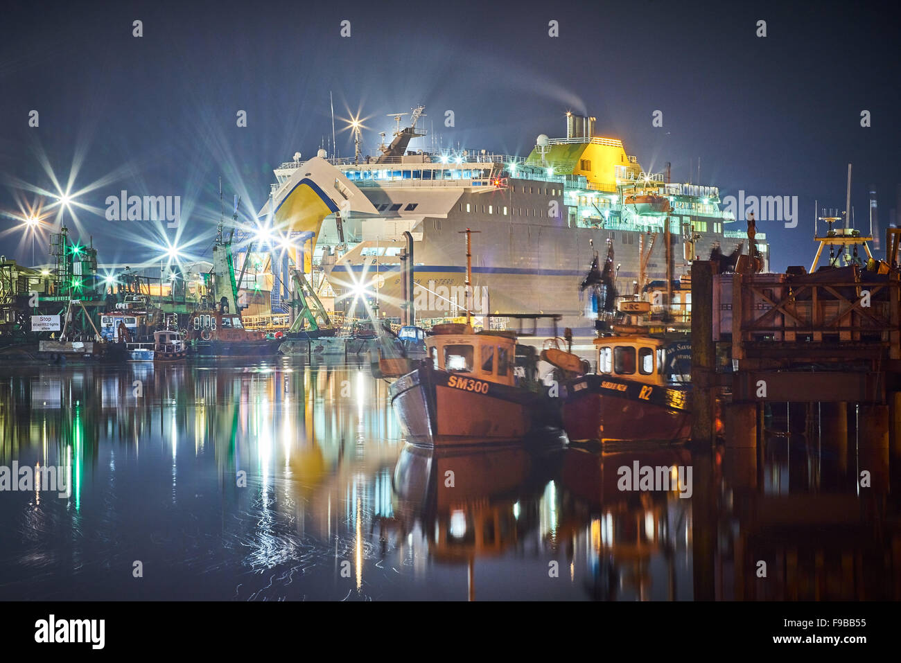 The ferry at Newhaven docks at night collecting passengers for its ...
