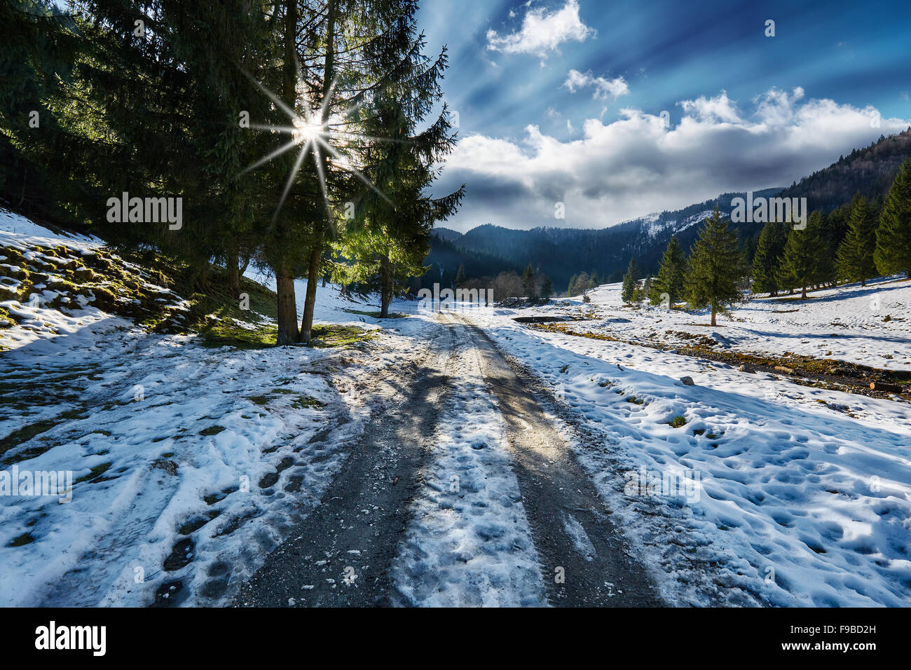 Winter landscape with rural road and mountains Stock Photo - Alamy