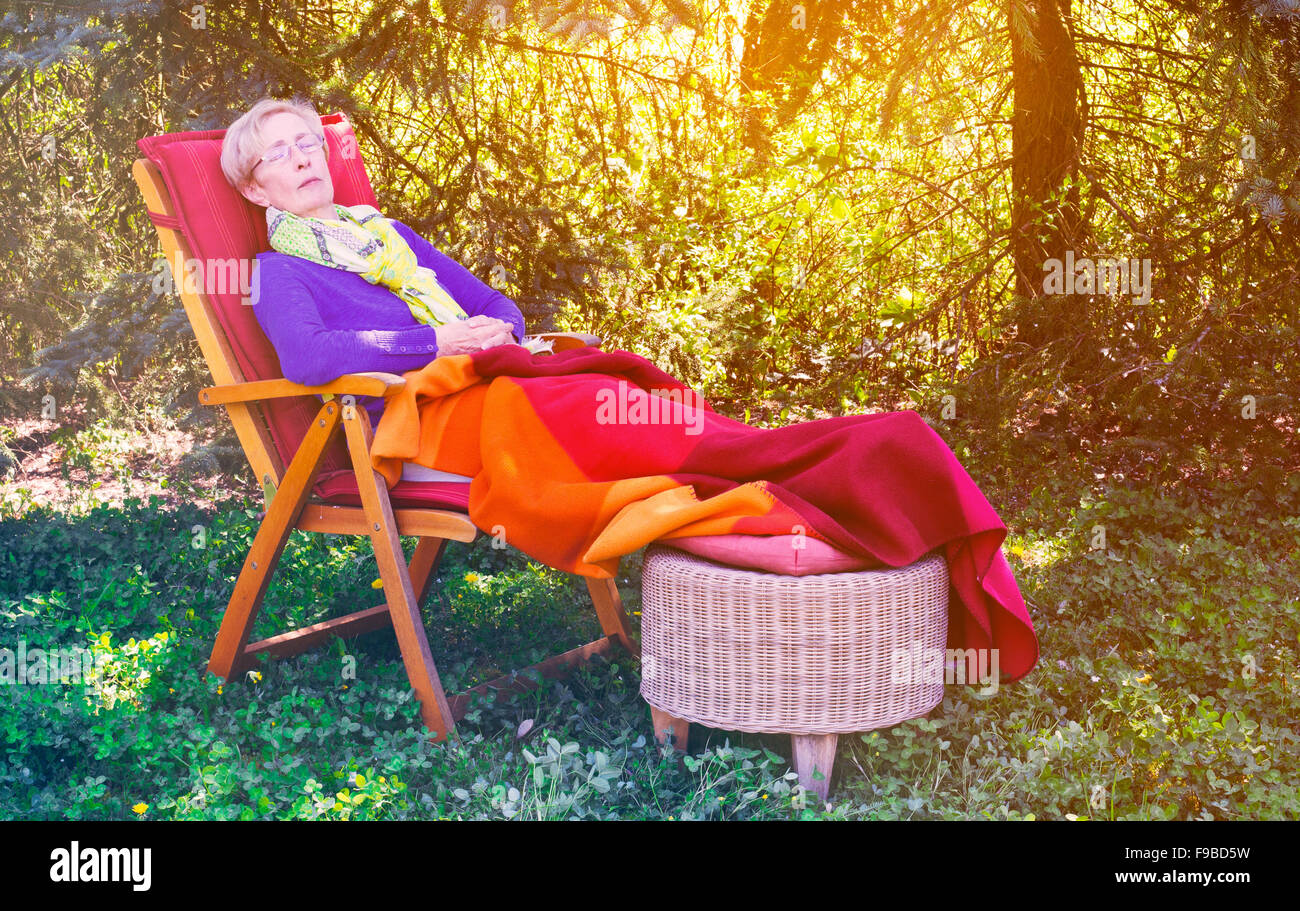 Woman sleeping in chair hi-res stock photography and images - Alamy