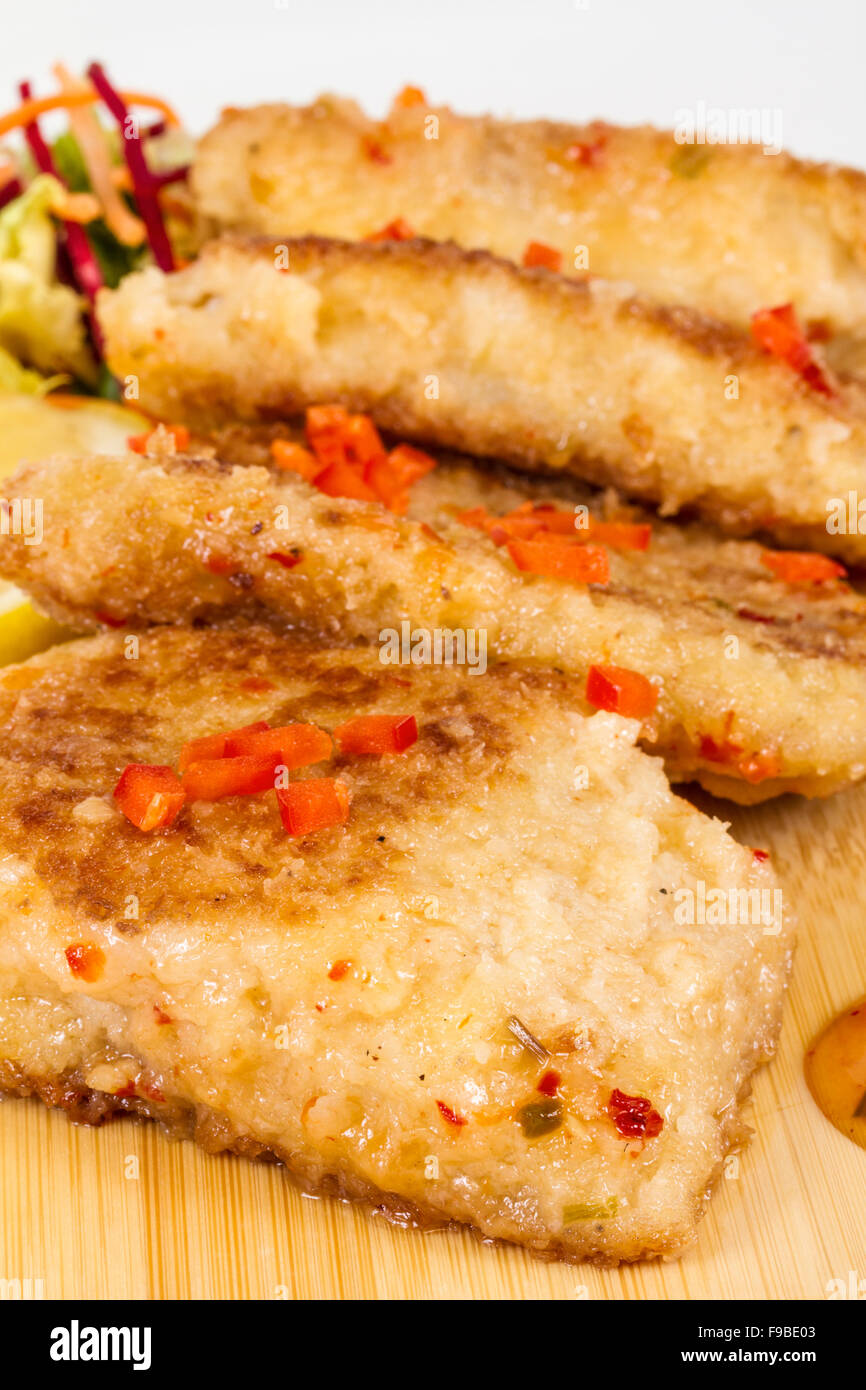 Fried fish fillets with salad Stock Photo - Alamy