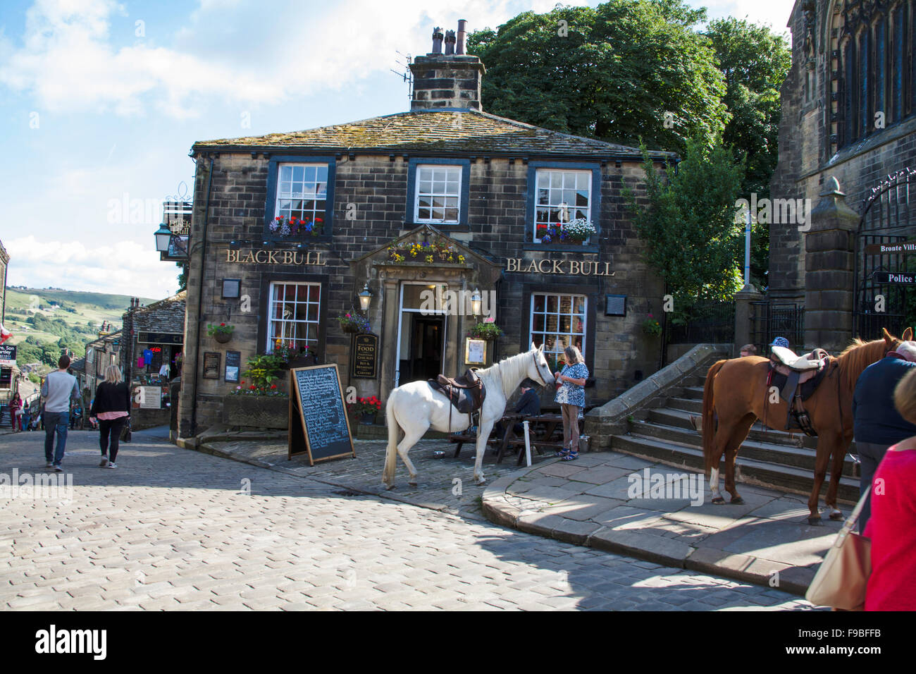 Horses resting outside The Black Bull Pub Haworth West Yorkshire ...