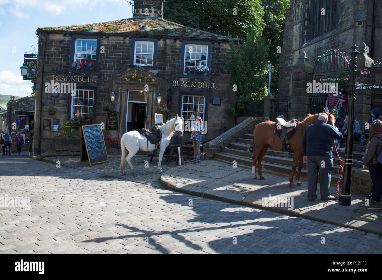 Horses resting outside The Black Bull Pub Haworth West Yorkshire ...