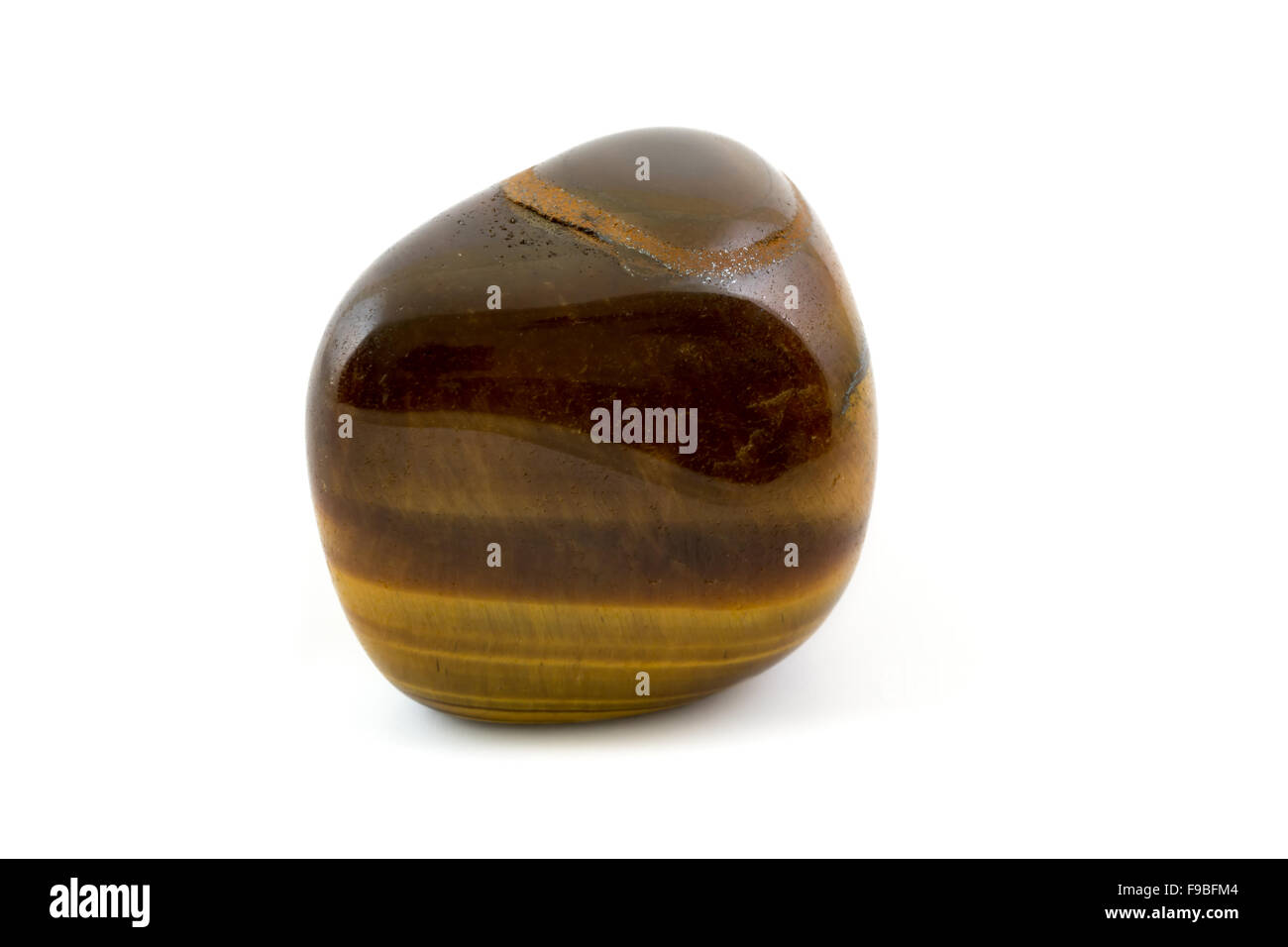 Tiger's eye adorable gemstone close up white background. Gives ...