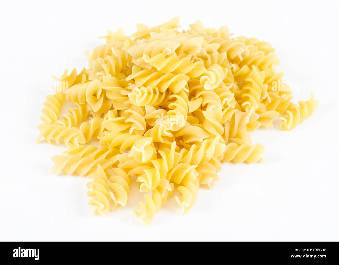 A portion of Rotini corkscrew pasta isolated on white Stock Photo - Alamy