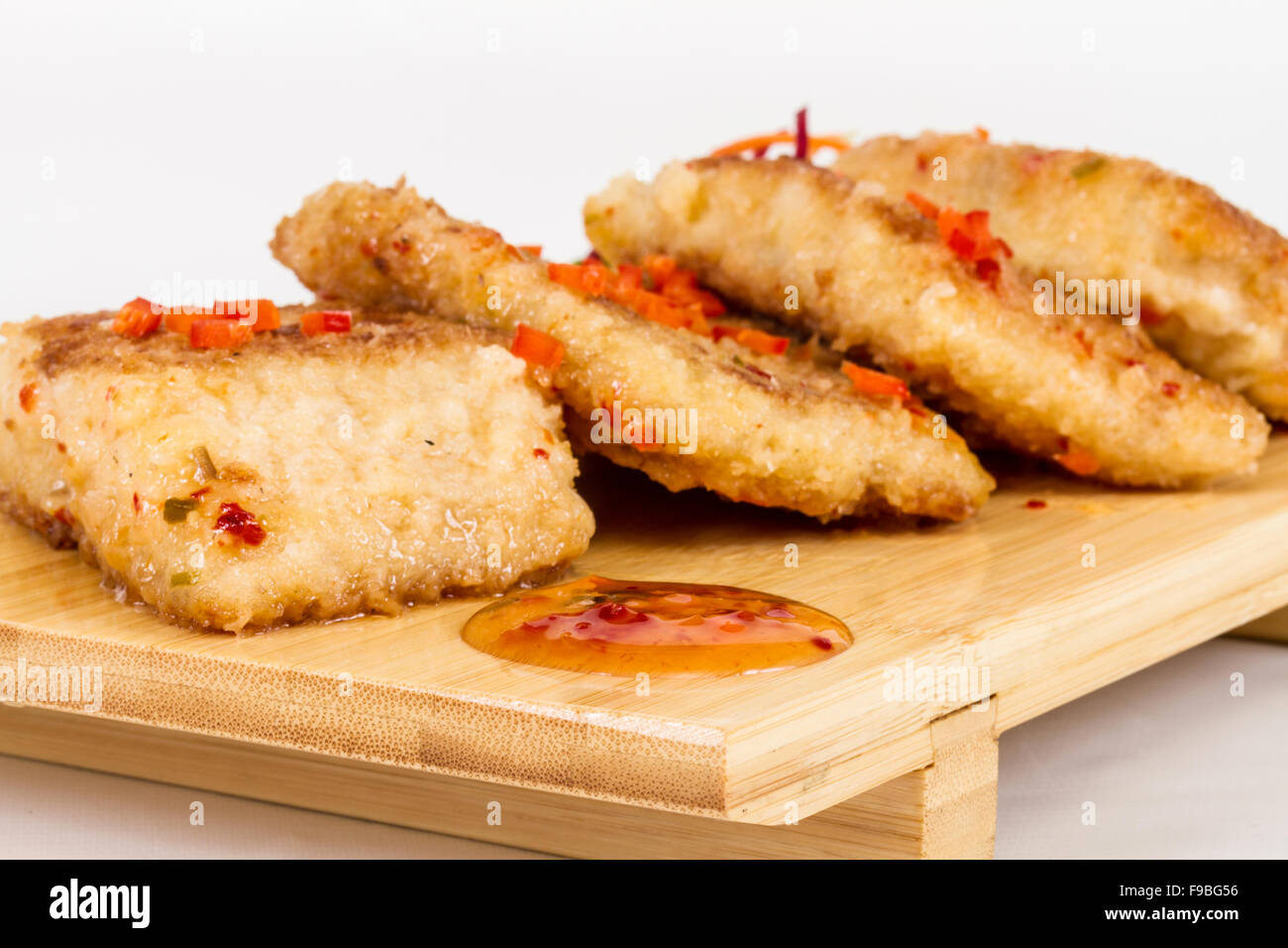 Fried fish fillets with salad Stock Photo - Alamy