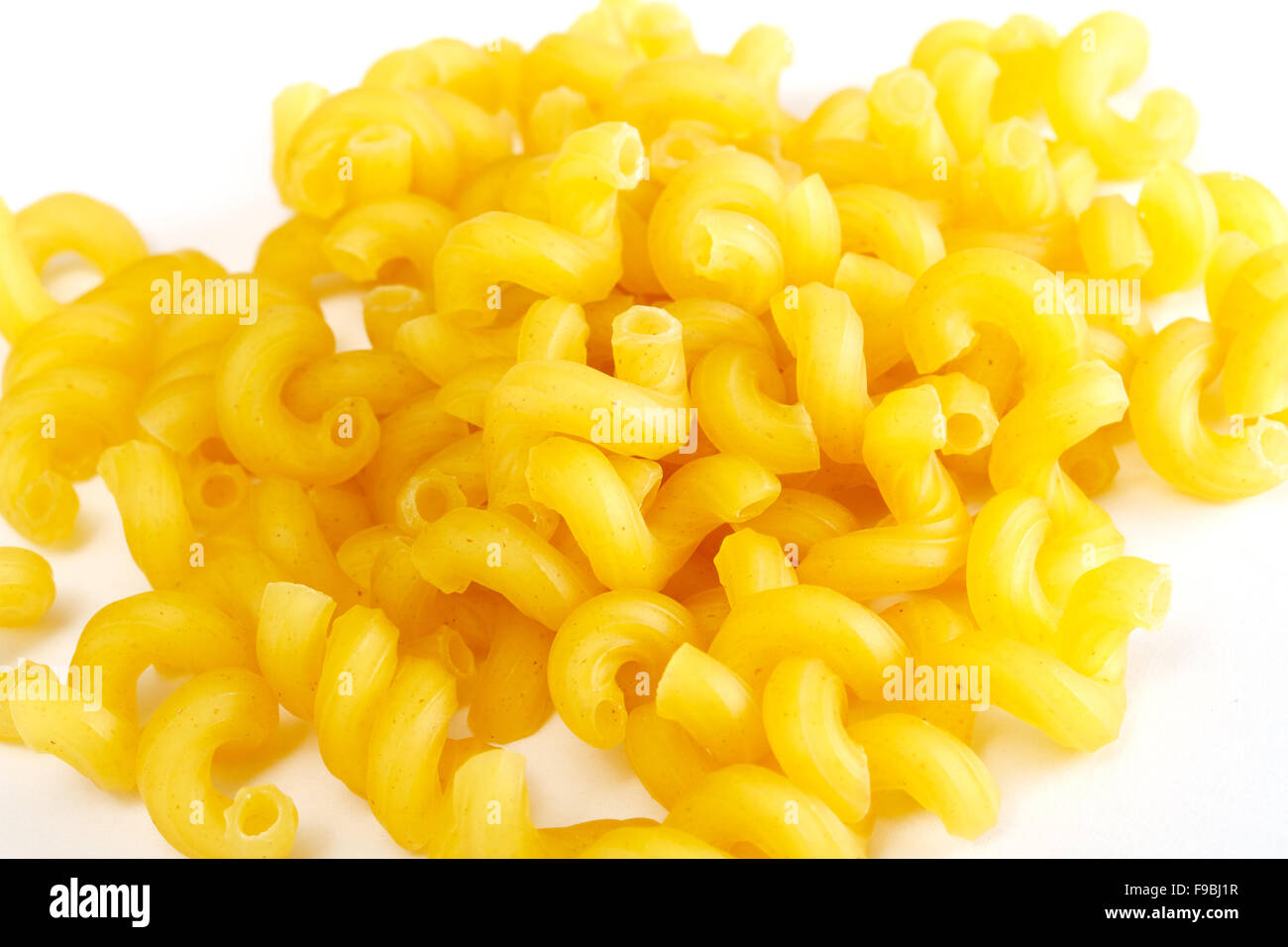dried italian pasta (macaroni) isolated on white background Stock Photo ...
