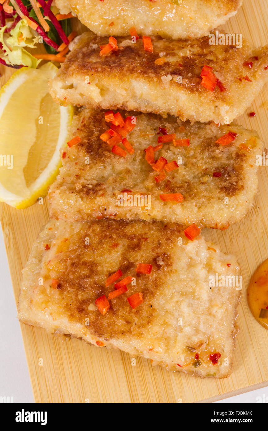 Fried fish fillets with salad Stock Photo - Alamy
