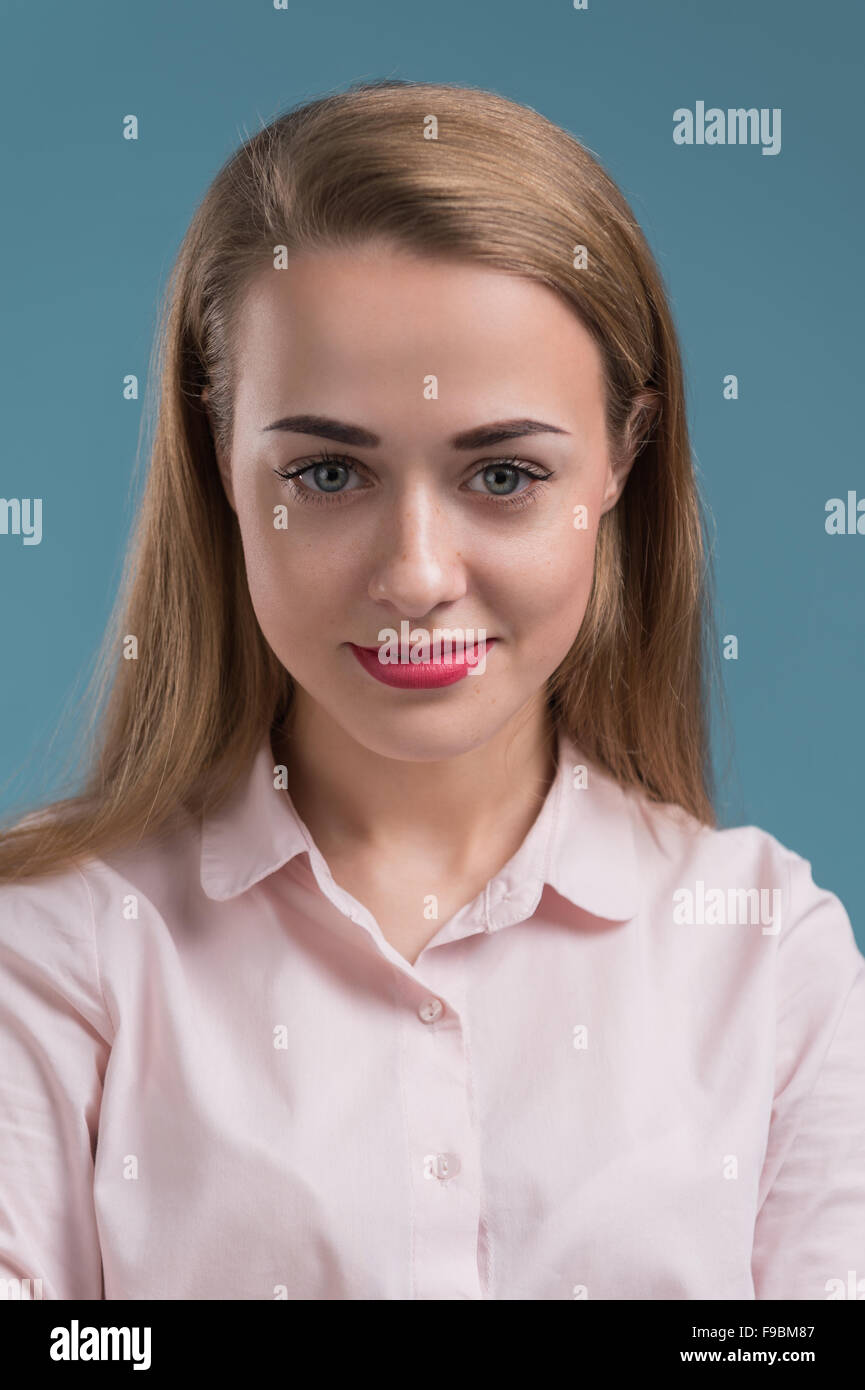 Business woman portrait on blue background Stock Photo - Alamy