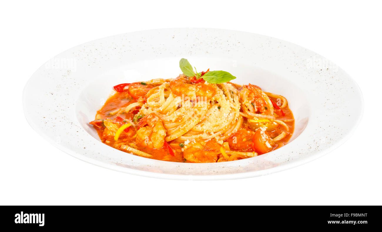 A plate of linguini with sauteed shrimp, tomato, chili and olive oil ...