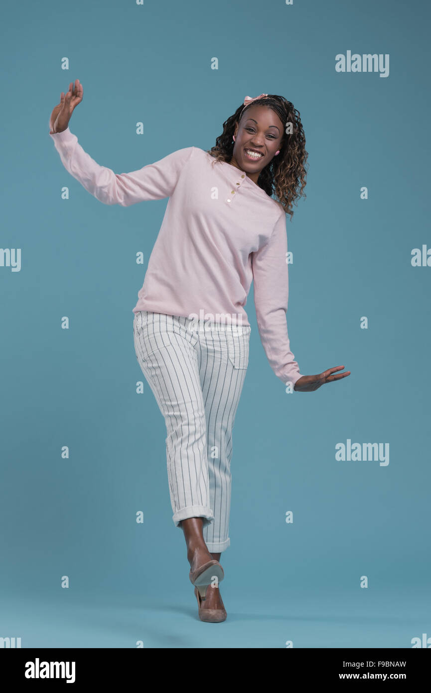 Young woman cute dancing pose hi-res stock photography and images - Alamy