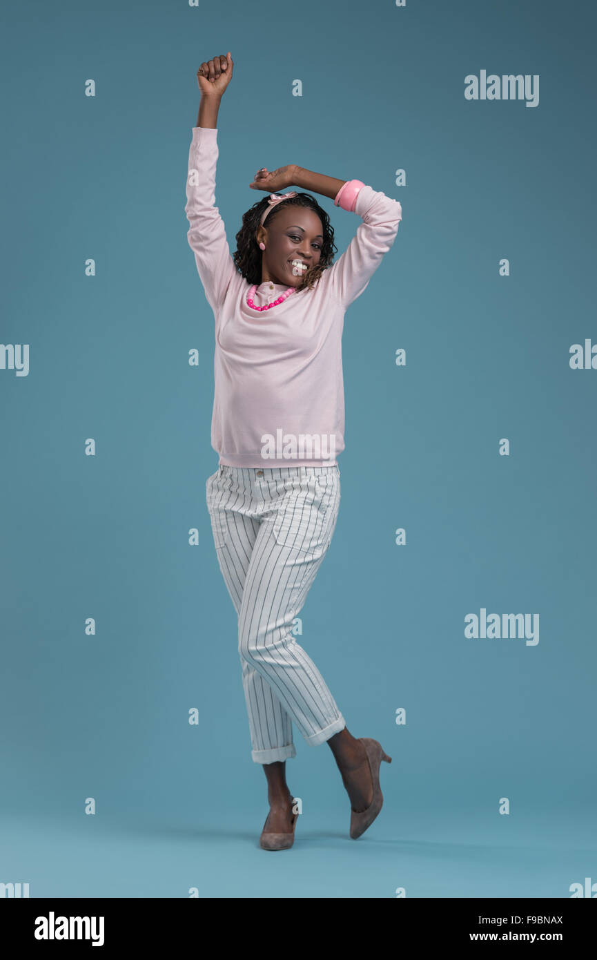 Young woman cute dancing pose hi-res stock photography and images - Alamy