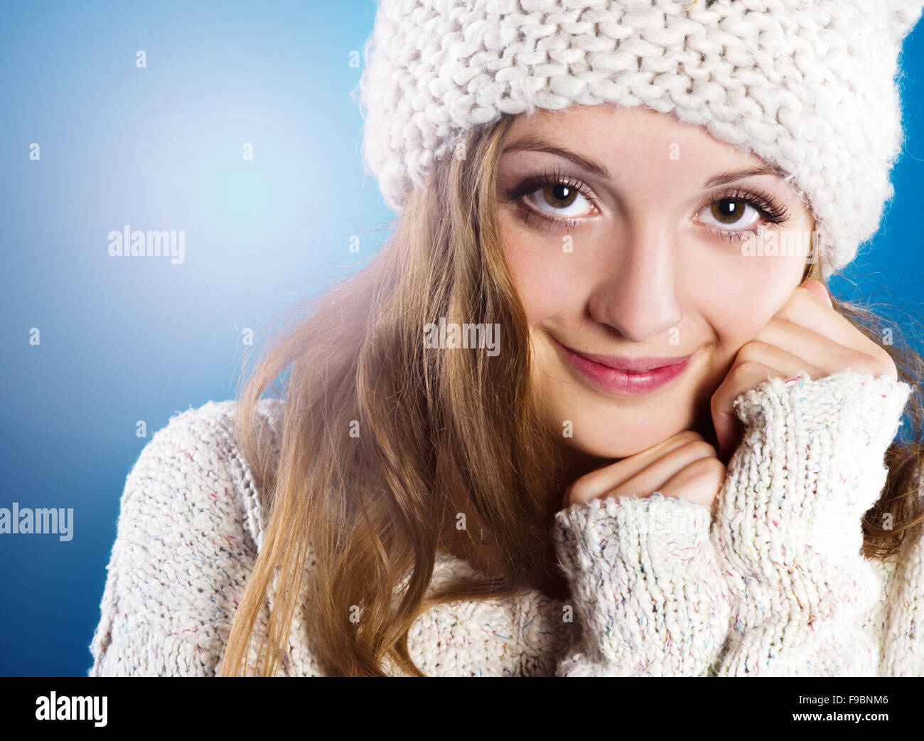 Woman happy blue background hi-res stock photography and images - Alamy