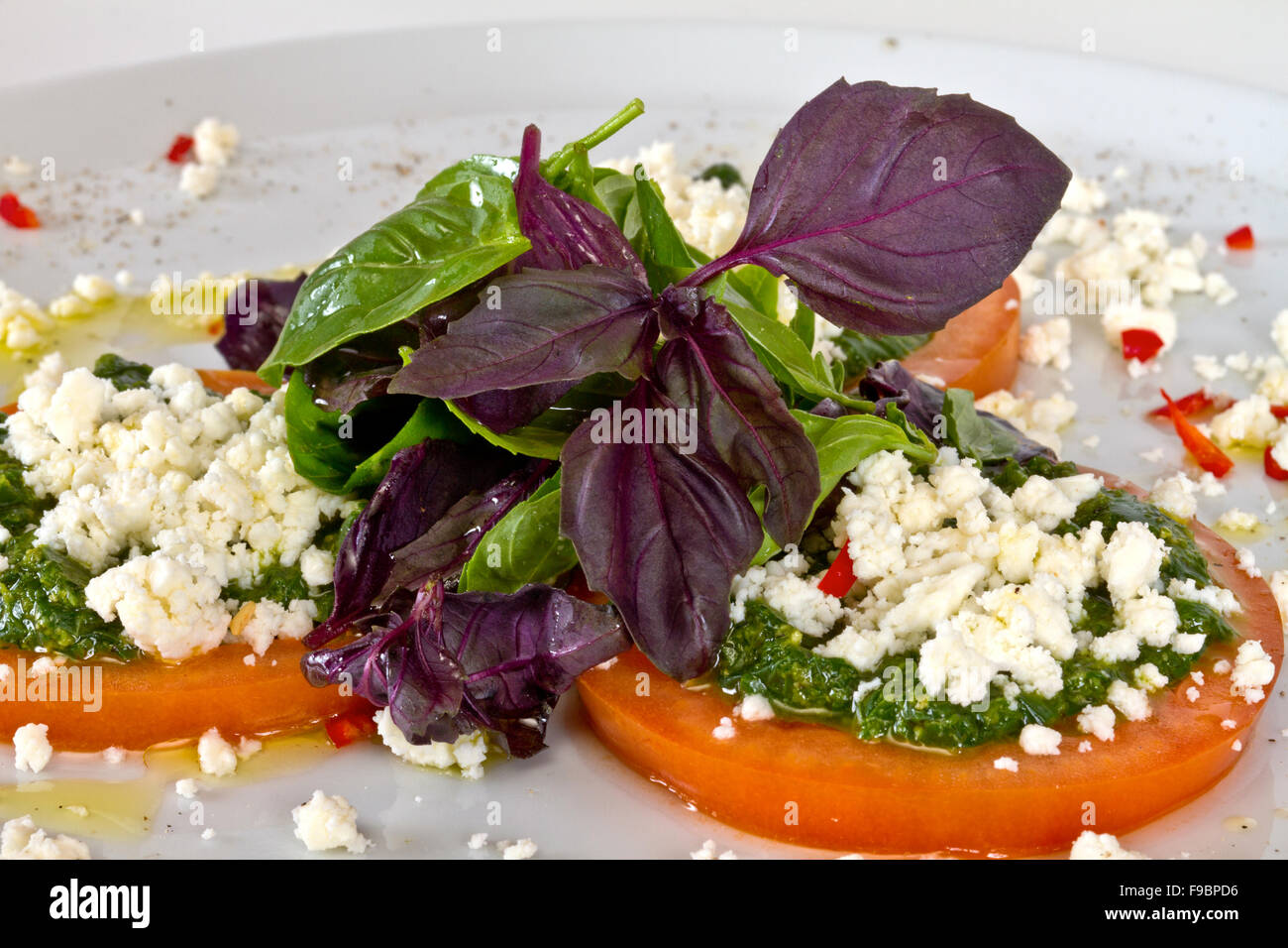 appetizer with tomato,cheese and pesto Stock Photo - Alamy