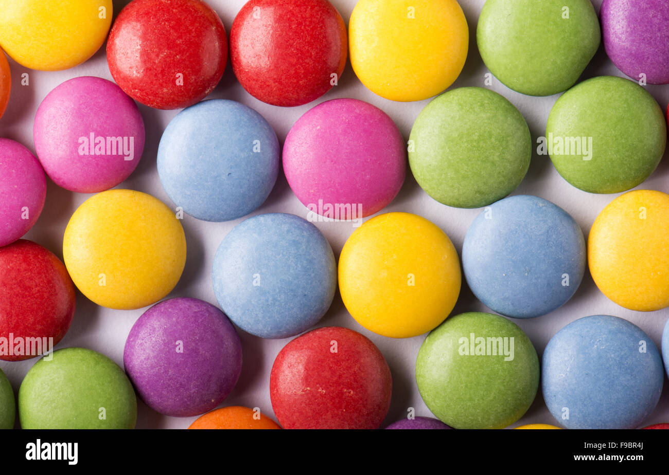 Studio concept with small round colorful candies Stock Photo - Alamy