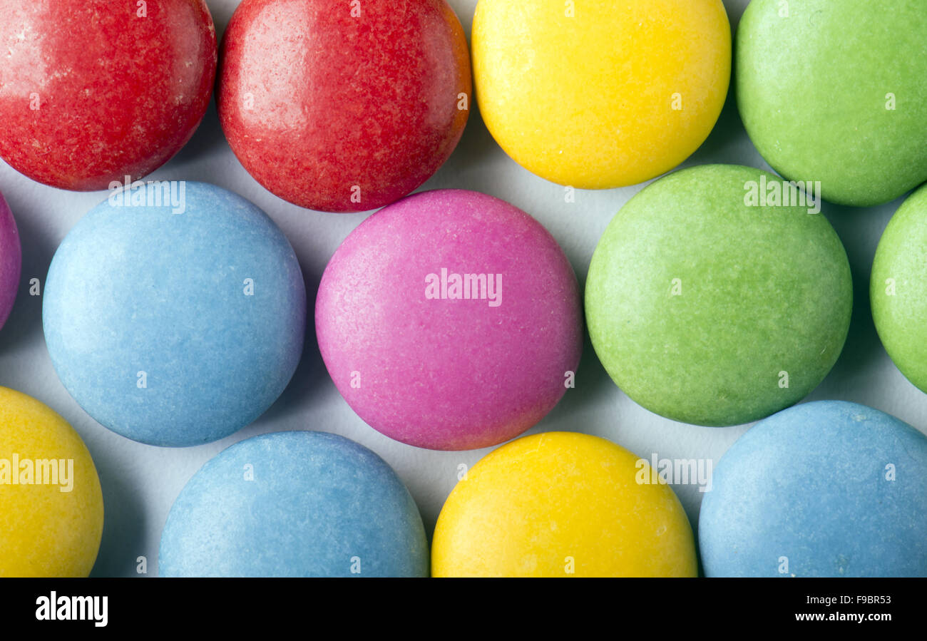 Studio concept with small round colorful candies Stock Photo - Alamy