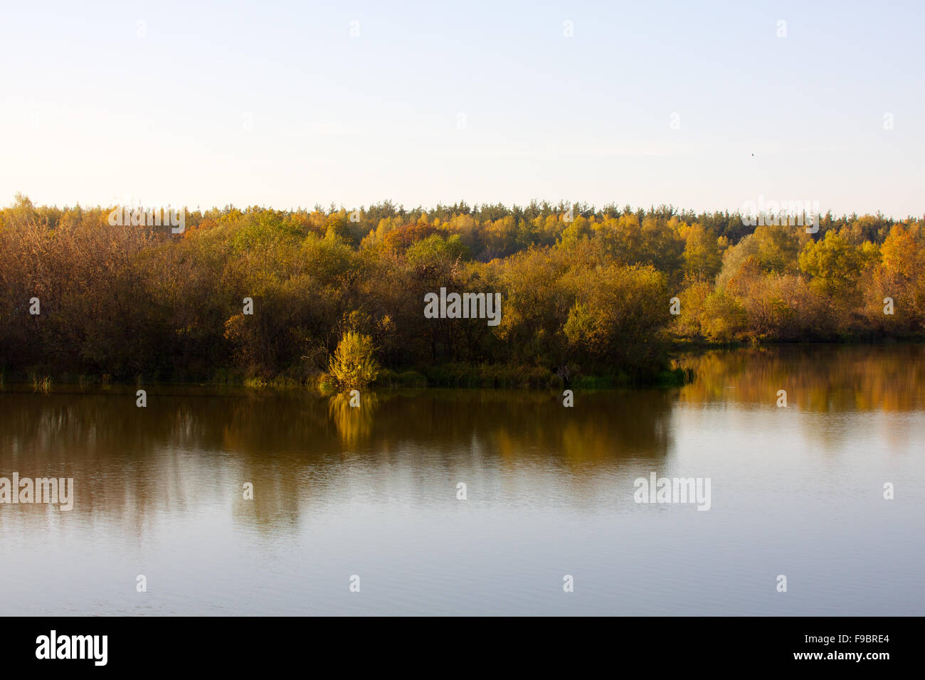 Colorful autumn trees fortress at the river front Stock Photo - Alamy