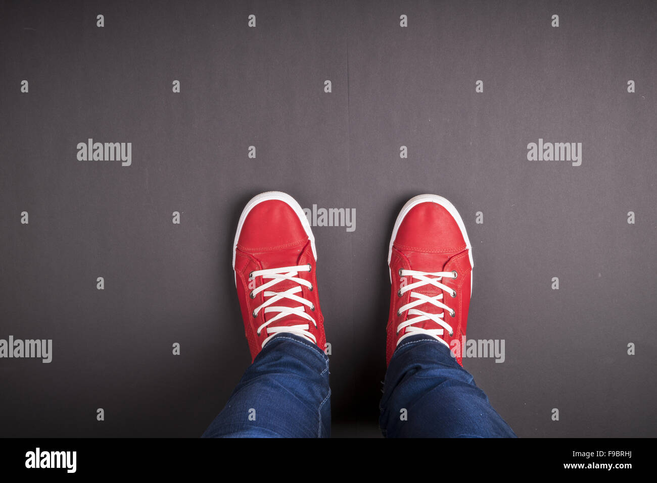 Feet concept - red shoes on black background with space for text or ...