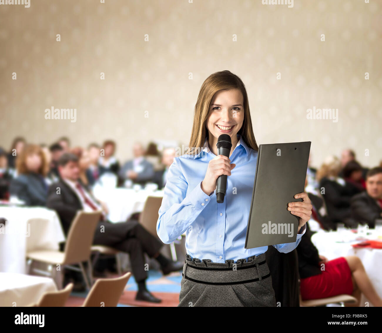 Beautiful business woman is speaking on conference Stock Photo - Alamy