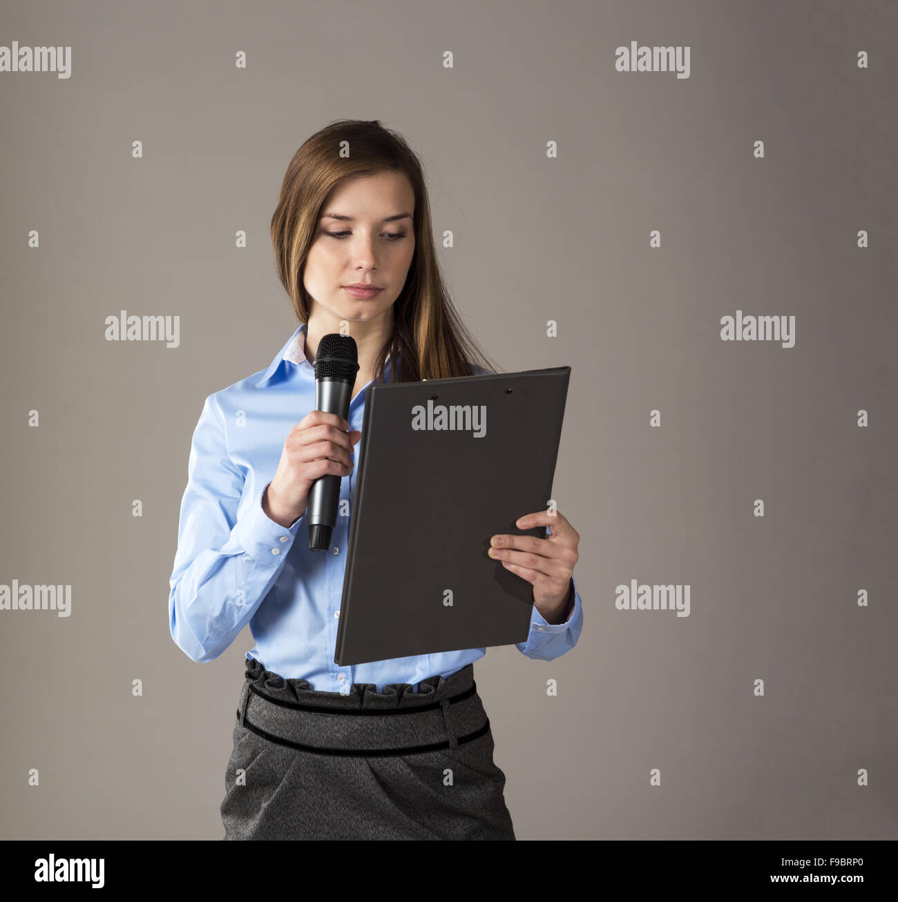 Beautiful business woman is speaking on conference Stock Photo - Alamy