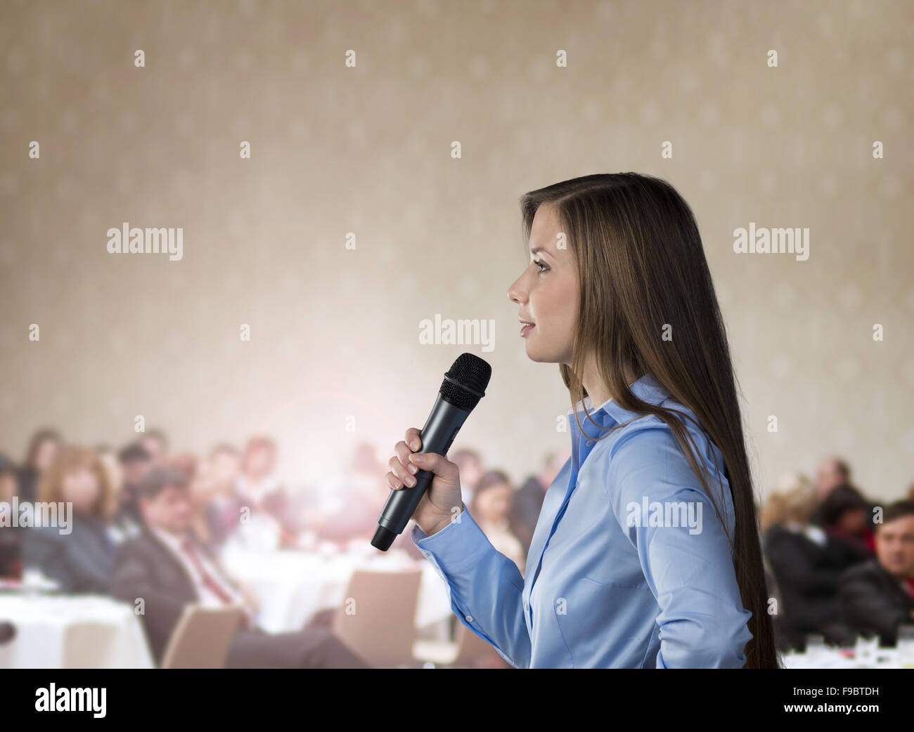 Beautiful business woman is speaking on conference Stock Photo - Alamy