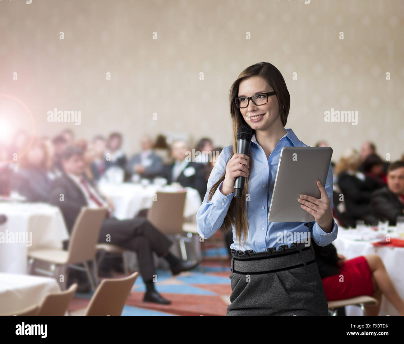 Beautiful business woman is speaking on conference Stock Photo - Alamy