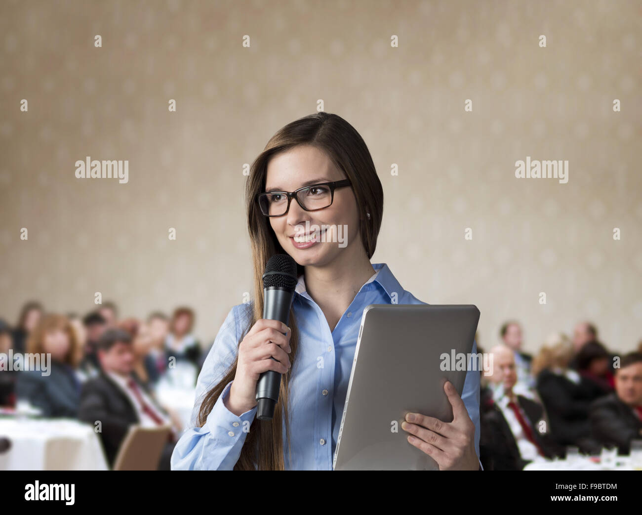 Beautiful business woman is speaking on conference Stock Photo - Alamy