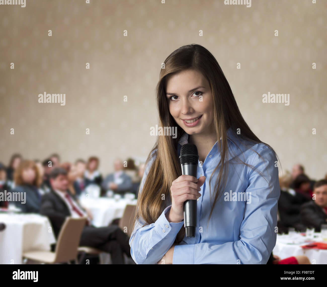Beautiful business woman is speaking on conference Stock Photo - Alamy