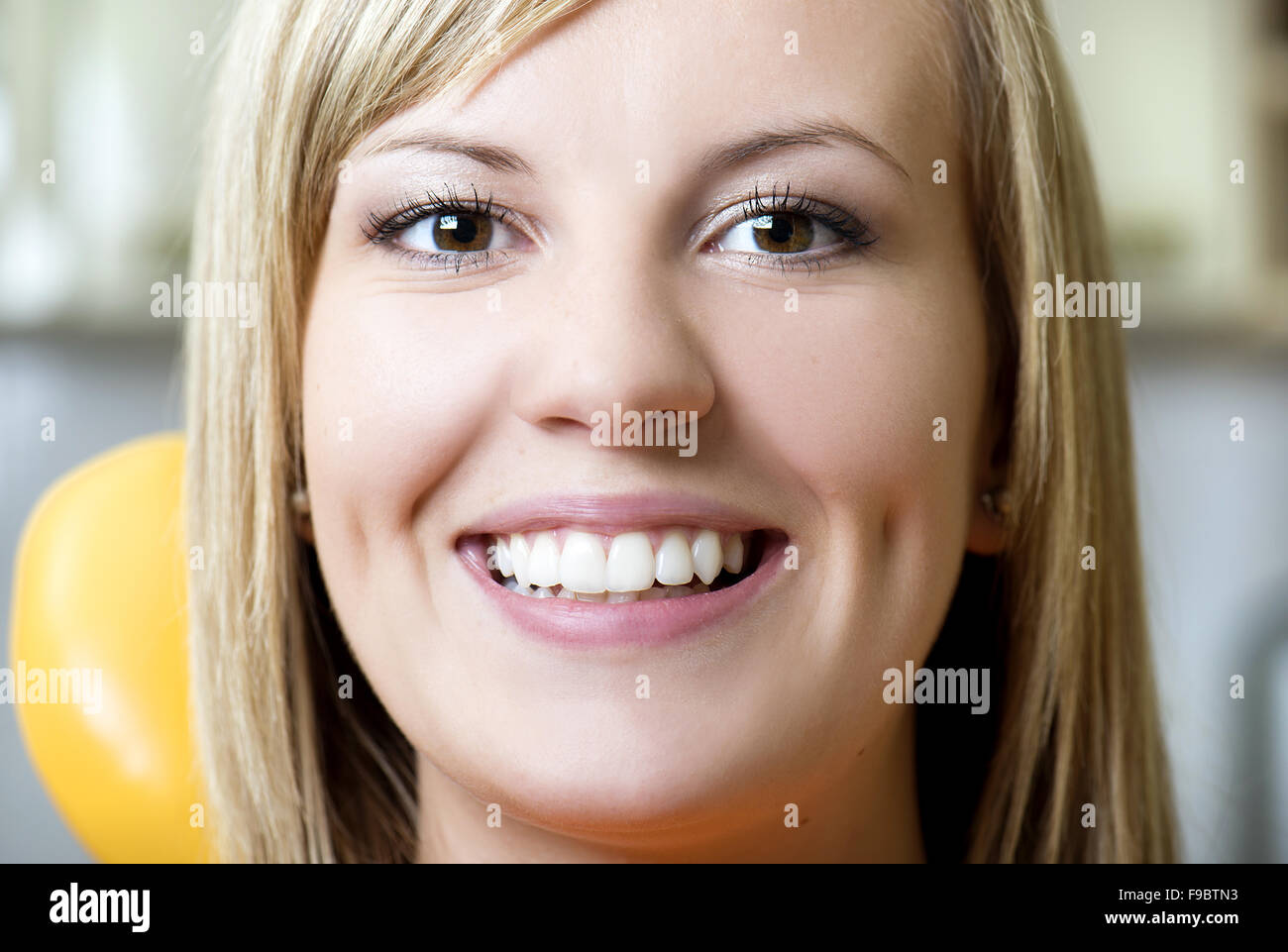 Beautiful girl is showing her white teeth at dentist Stock Photo - Alamy