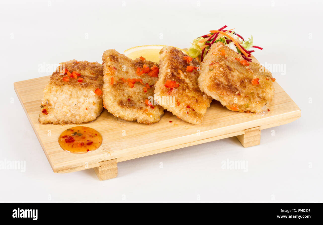 Fried fish fillets with salad Stock Photo - Alamy